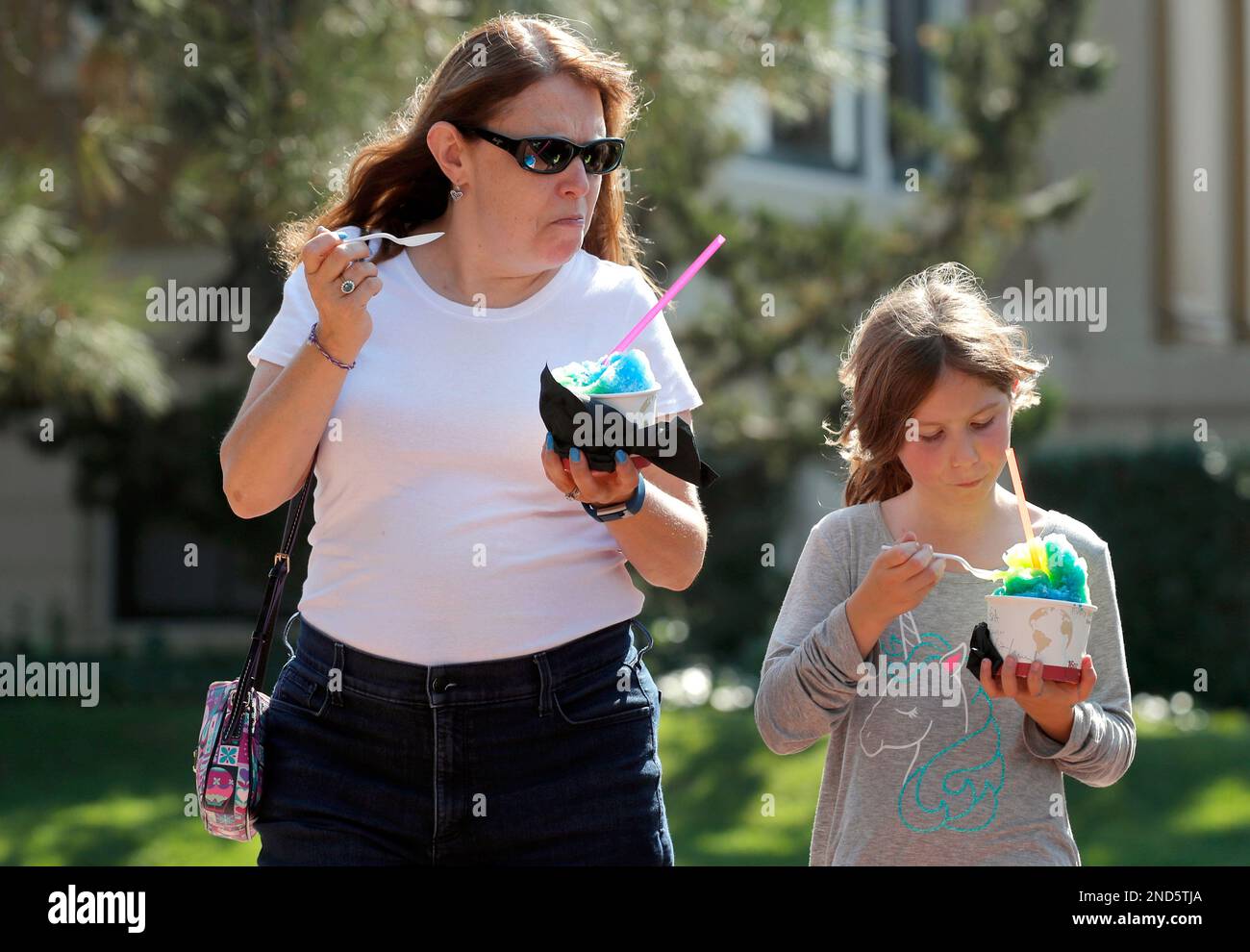 Kara Simone and her daughter Sophia, of Pleasanton enjoy a cold shave ...