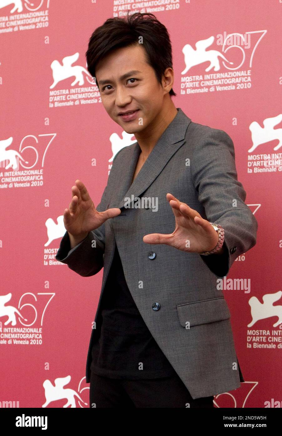 Actor Deng Chao poses at the photo call for the film Di Renjie Zhi ...
