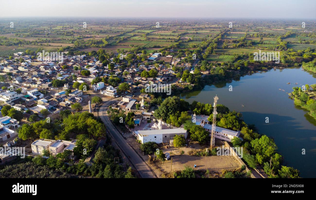 Aerial drone photography of urban-rural houses green village near water ...