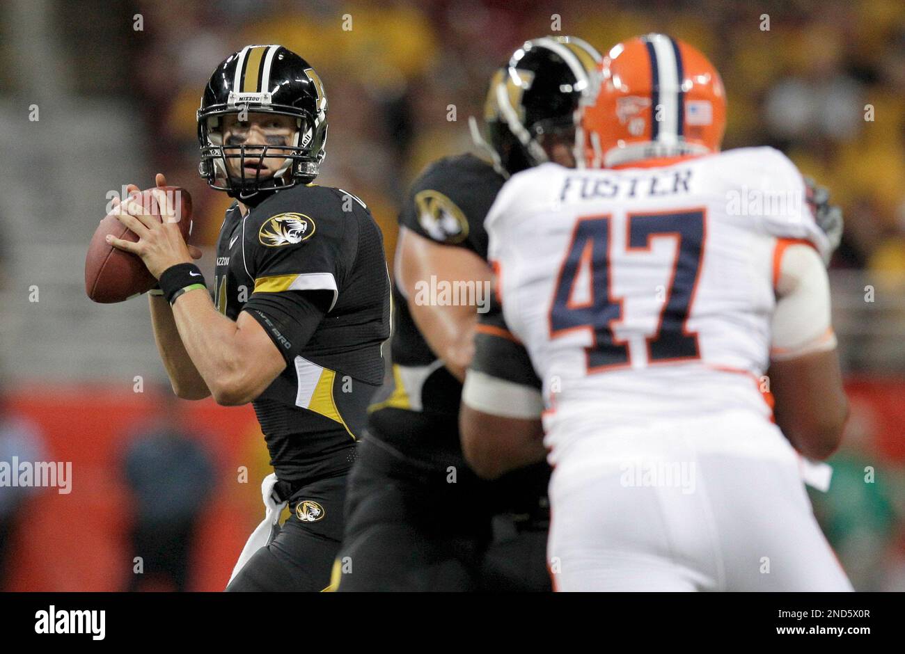 Missouri quarterback Blaine Gabbert, left, looks to throw as Illinois ...