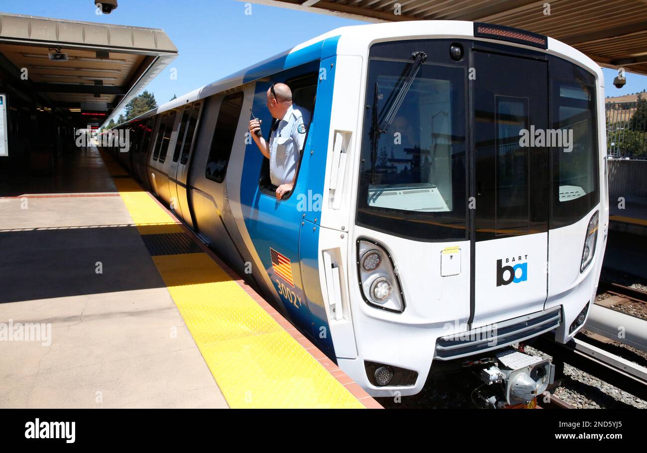 The train operator checks the platform as BART shows off one of their ...