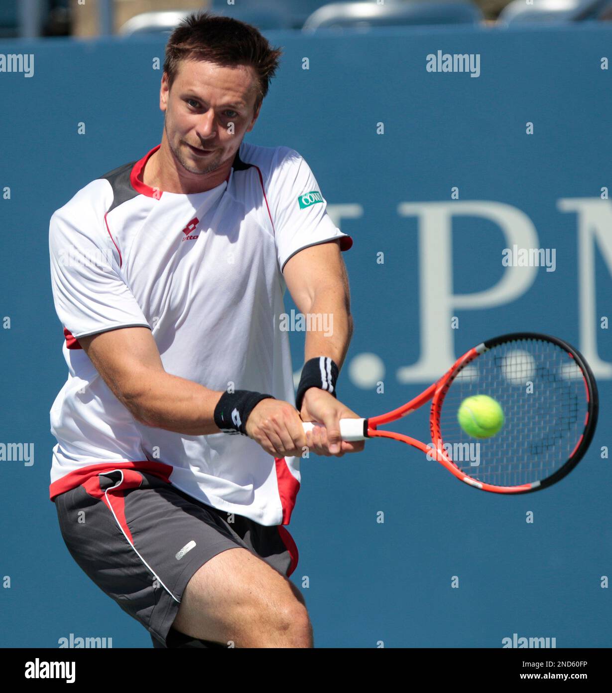 Robin Soderling of Sweden returns the ball to Thiemo de Bakker of the ...