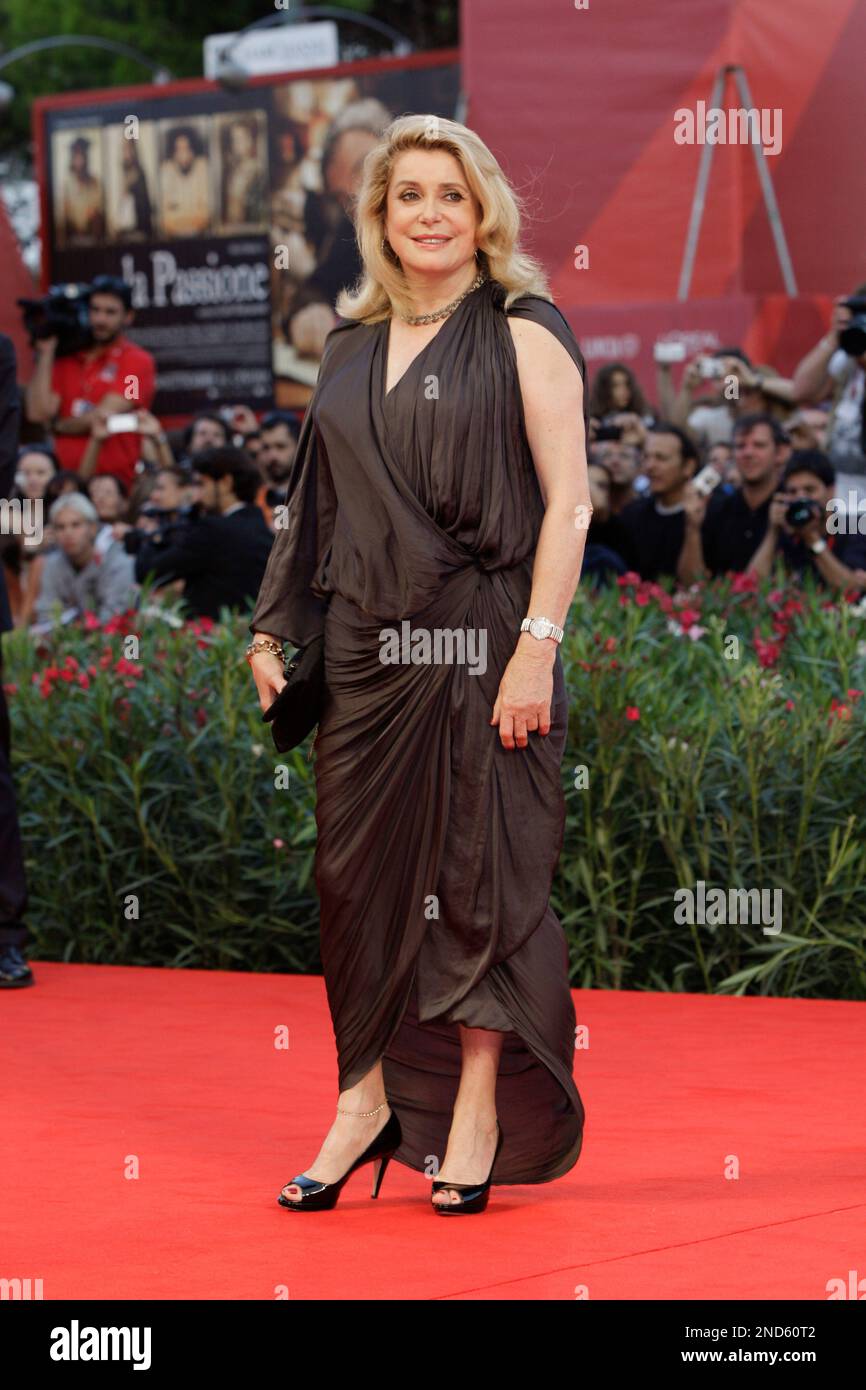 Actress Catherine Deneuve arrives for the screening of the film Potiche ...