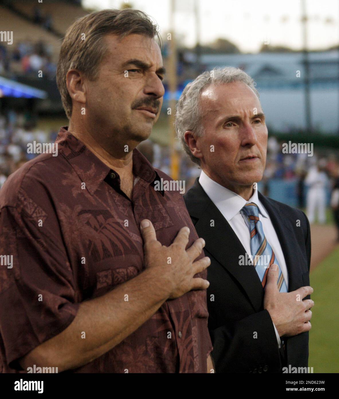 Los Angeles Dodgers owner Frank McCourt, right, joins Los Angeles ...