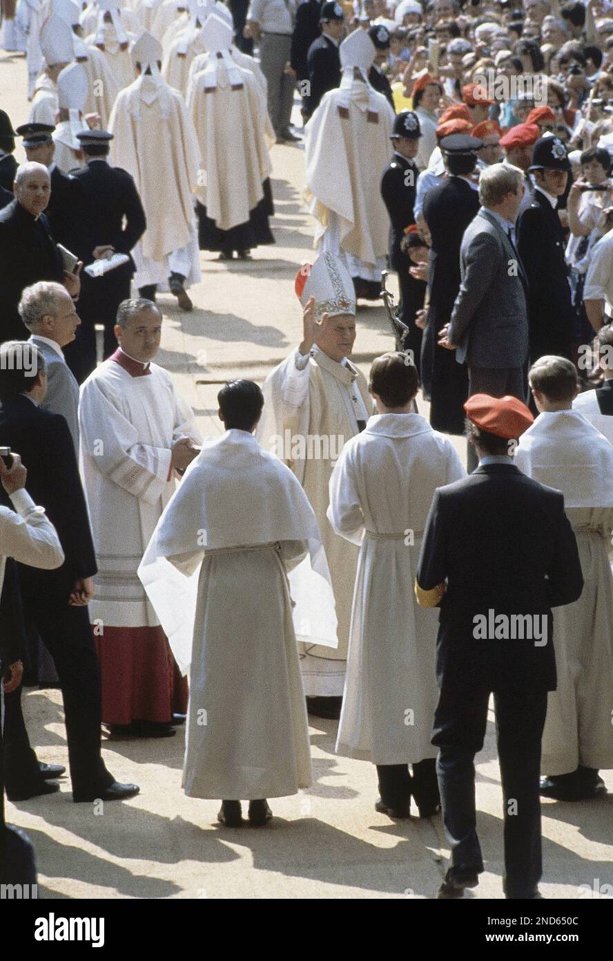 Pope John Paul II, the Leader of the Roman Catholic Church waves whilst ...