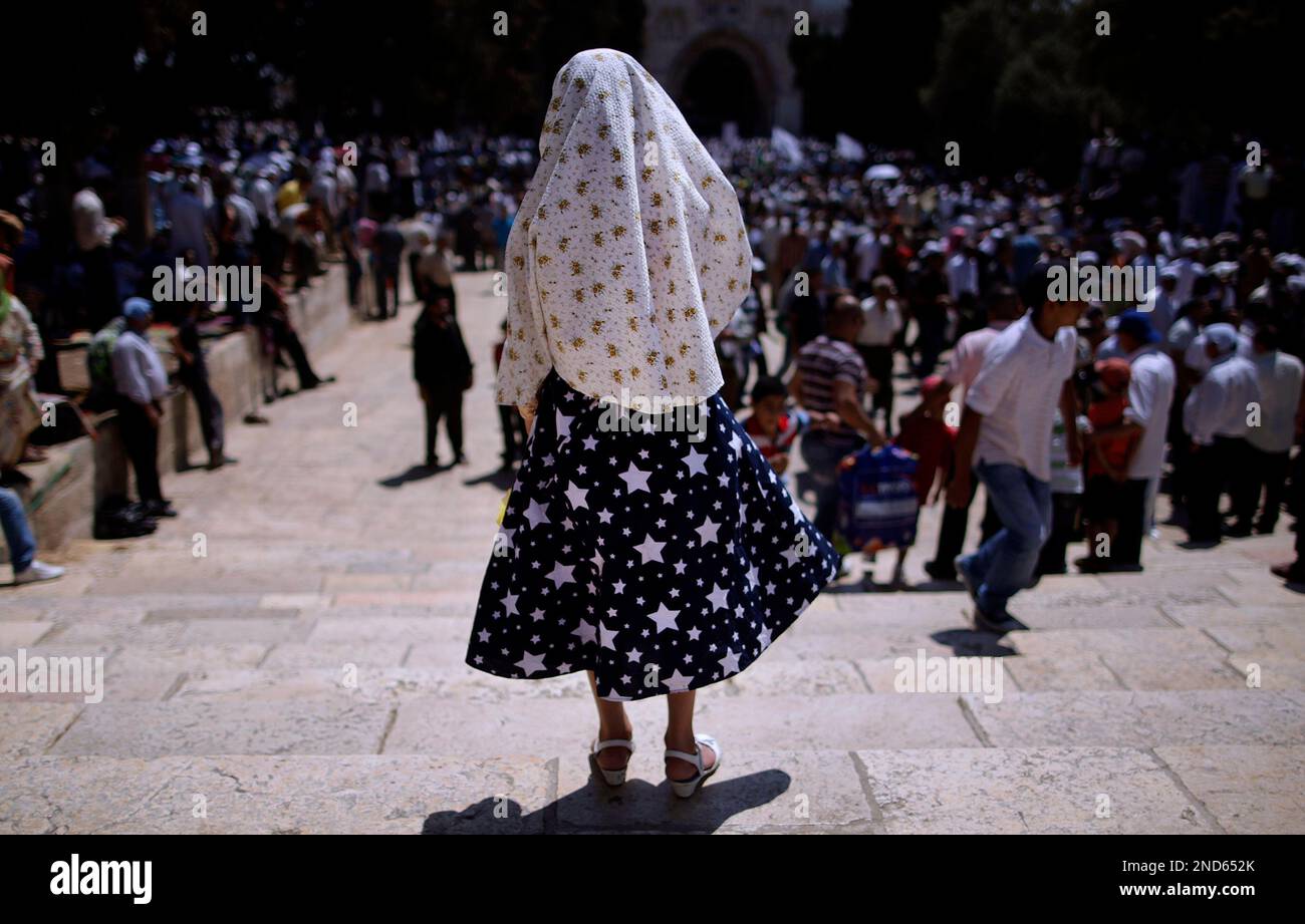 A Palestinian Muslim girl stands on the stairs of Al-Aqsa Mosque ...