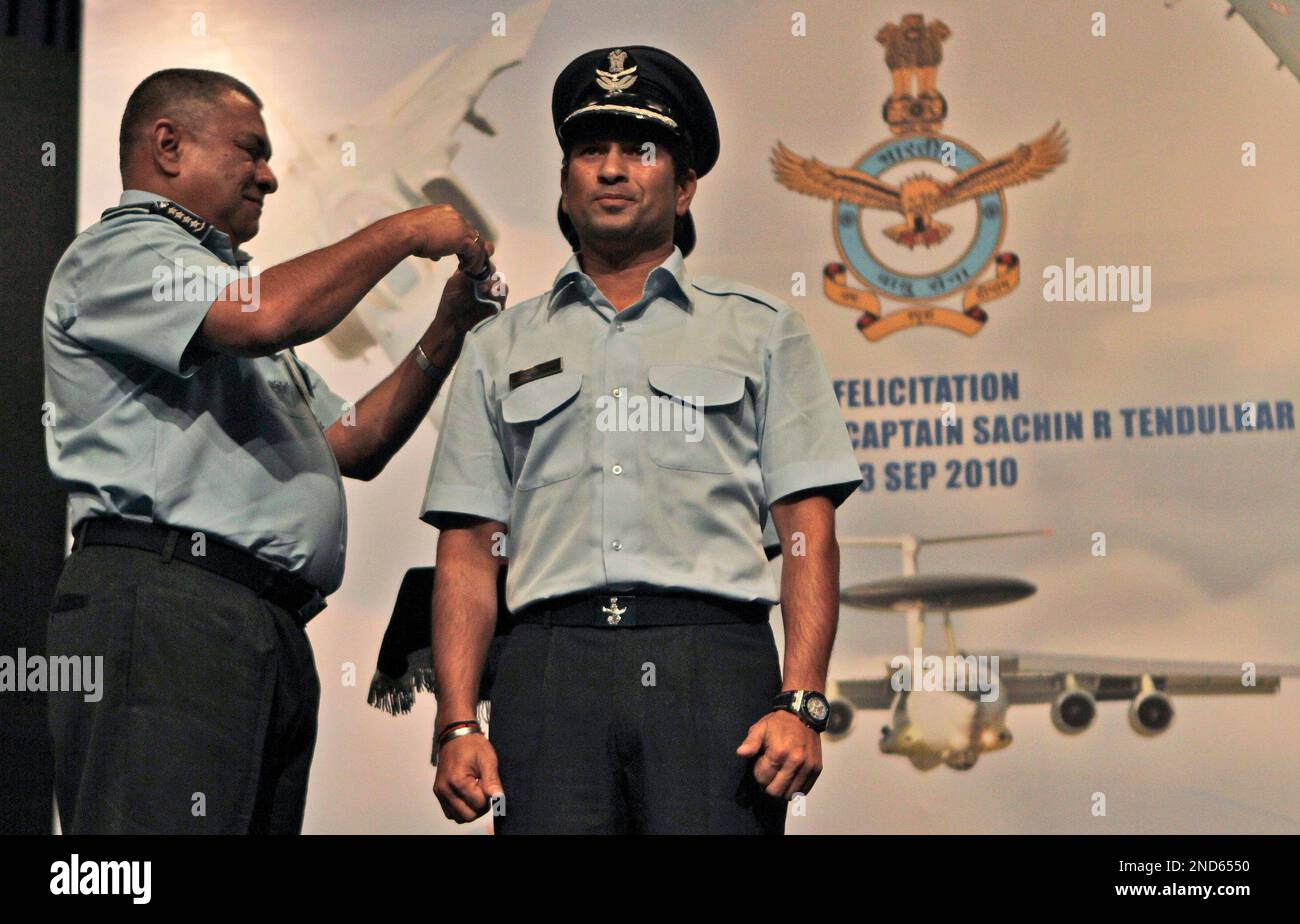 Indian cricketer Sachin Tendulkar, right, receives the honorary rank of ...