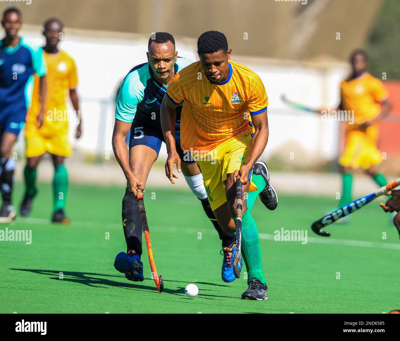 Nigeria Police Henry Jabeoba dribbles past Khalsa Moshi James Paulo ...