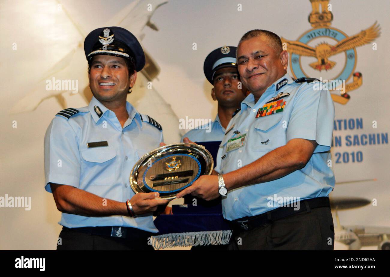 Indian cricketer Sachin Tendulkar, left, receives the honorary rank of ...