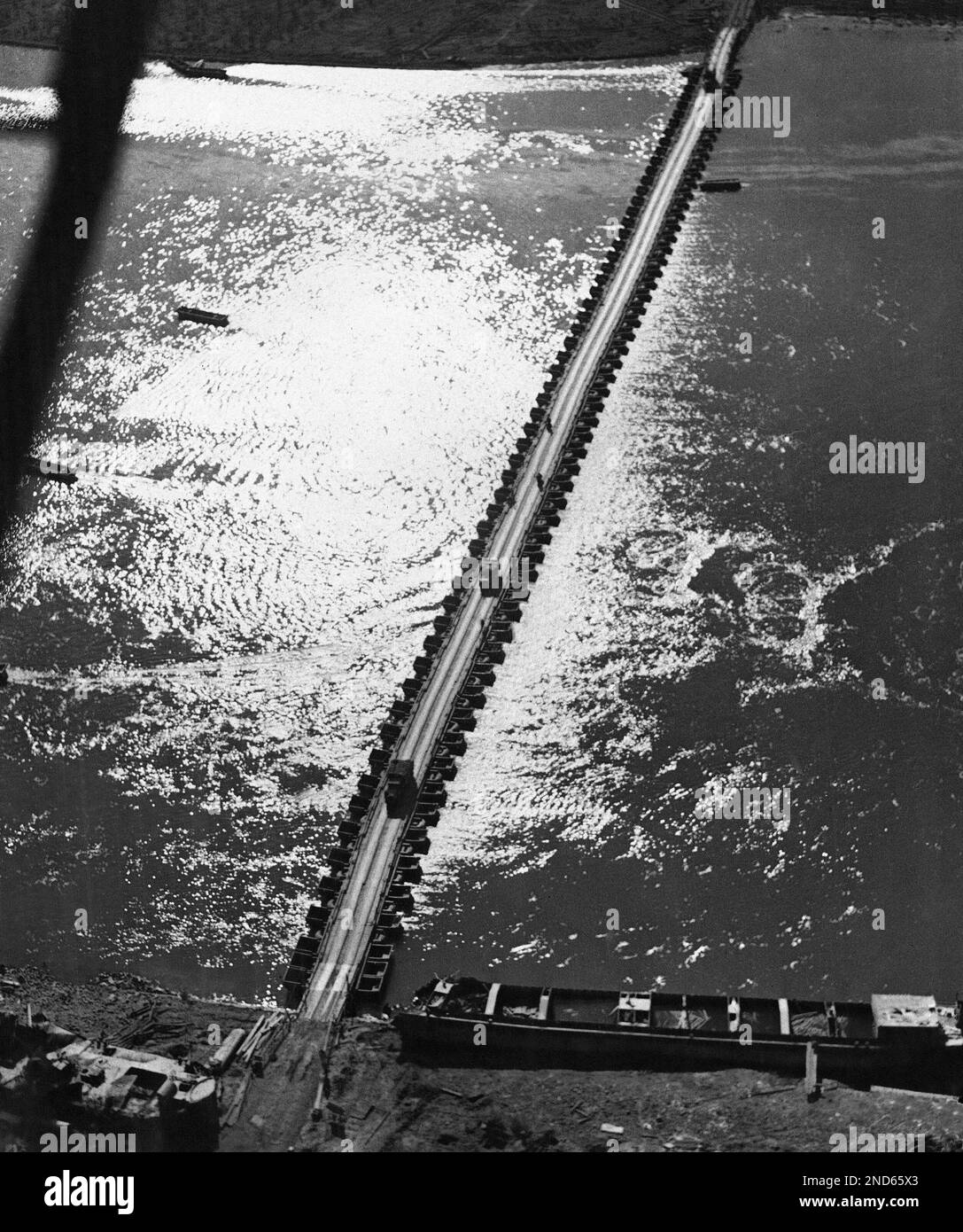 This aerial view shows the First Army’s pontoon bridge across the River ...