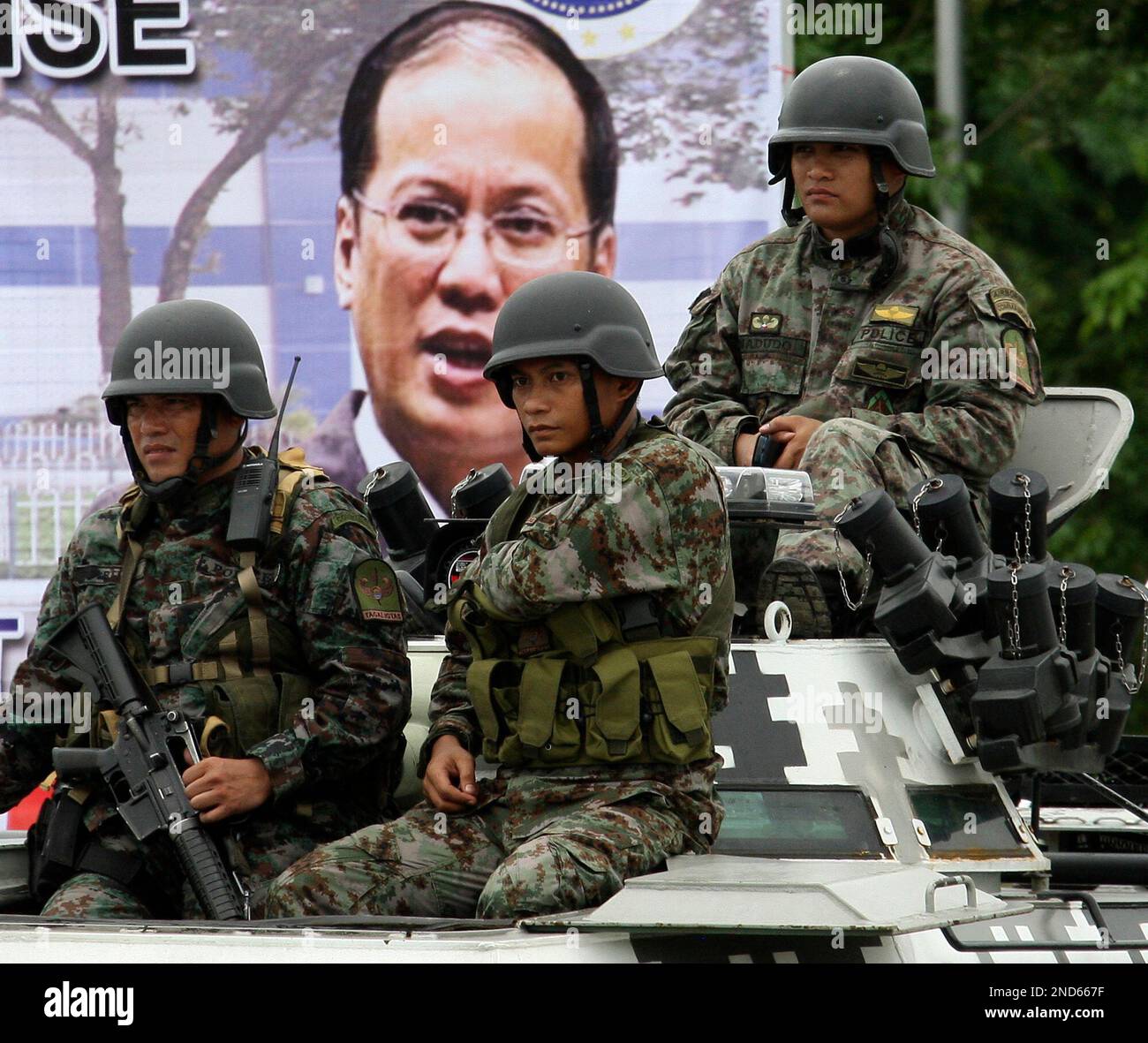 Philippine National Police officers watch from their Armored Personnel ...