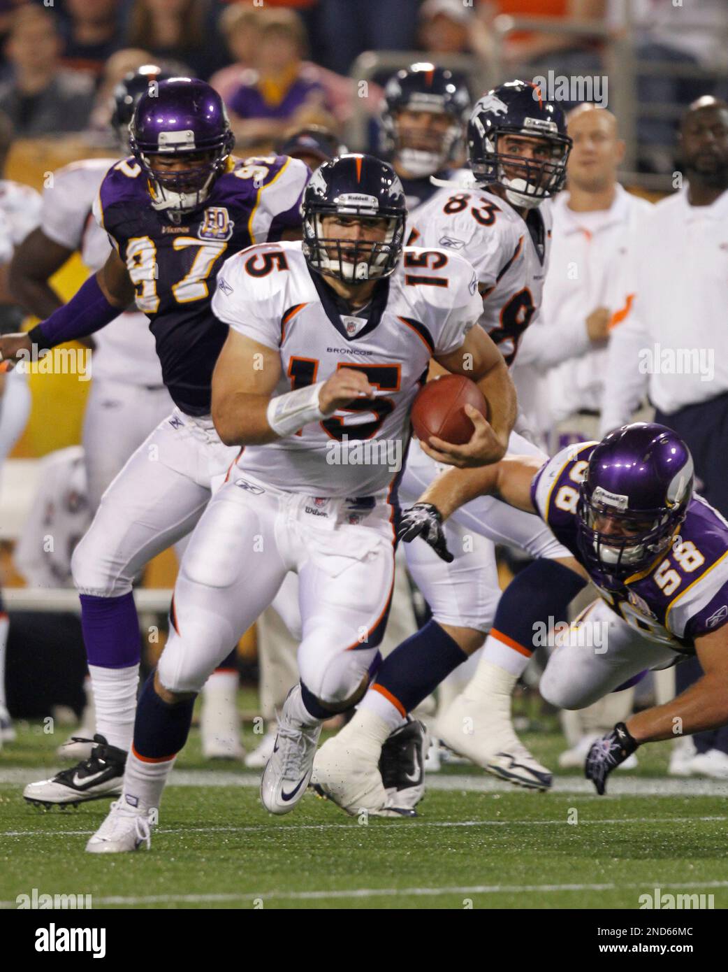 Denver Broncos quarterback Tim Tebow (15) runs under pressure from ...