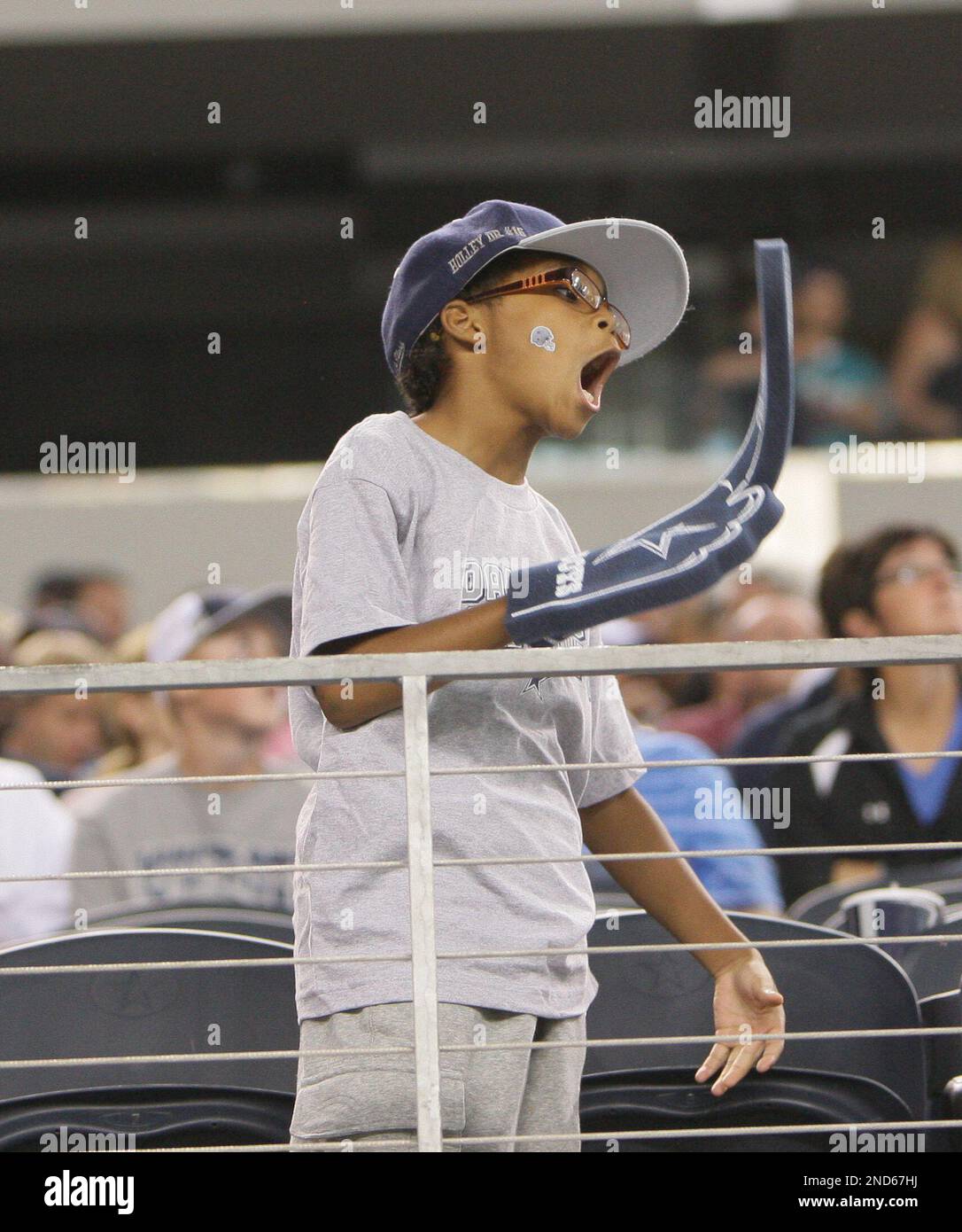 A young Dallas Cowboys fan during a preseason NFL football game against ...