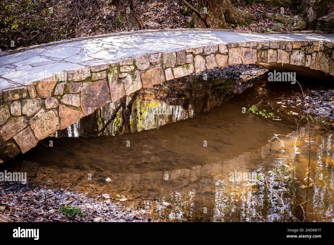 A small stone arch bridge over the water Stock Photo - Alamy