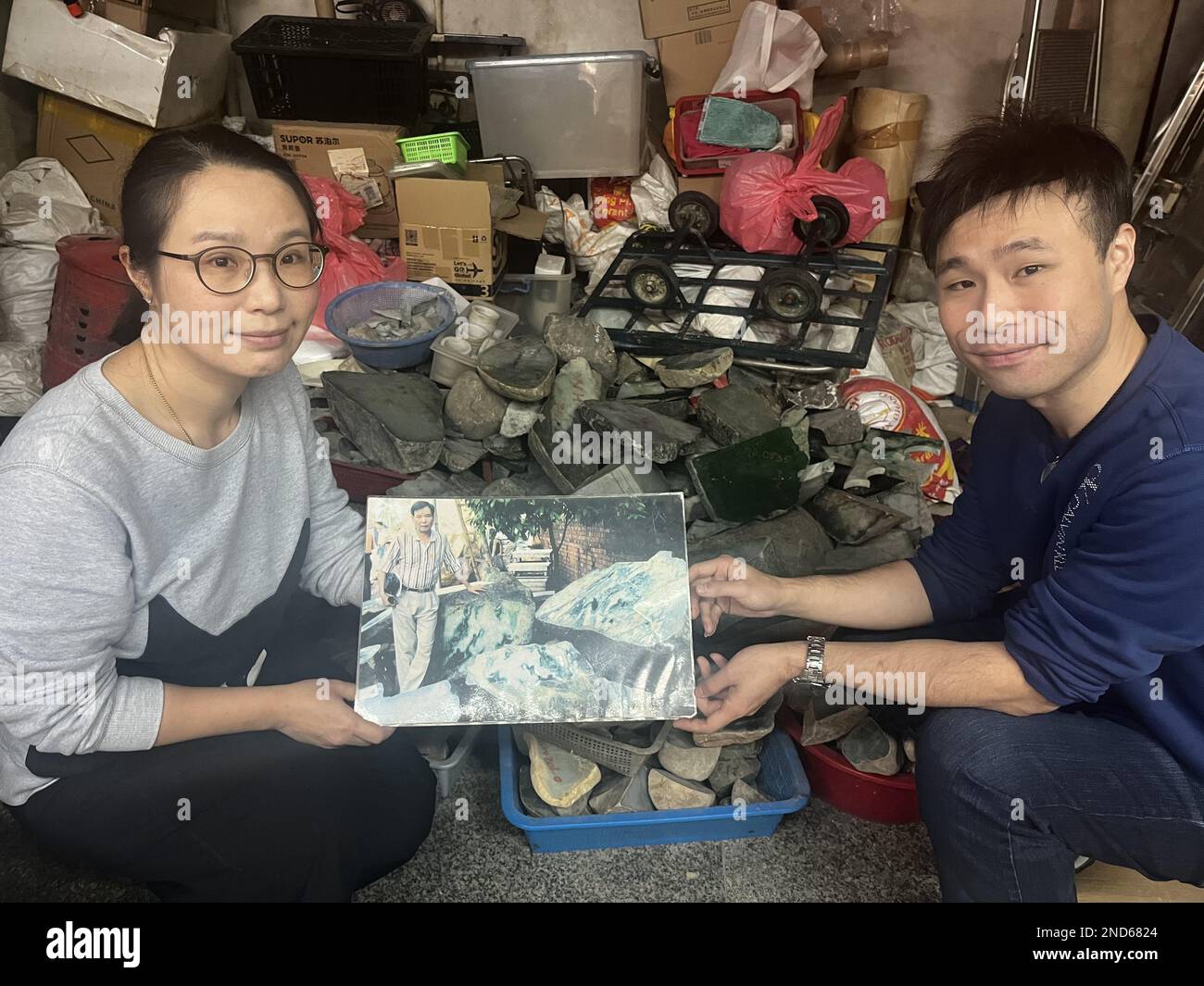 Anna Hui and her brother Davis with a photo of their father Hui Cheong ...