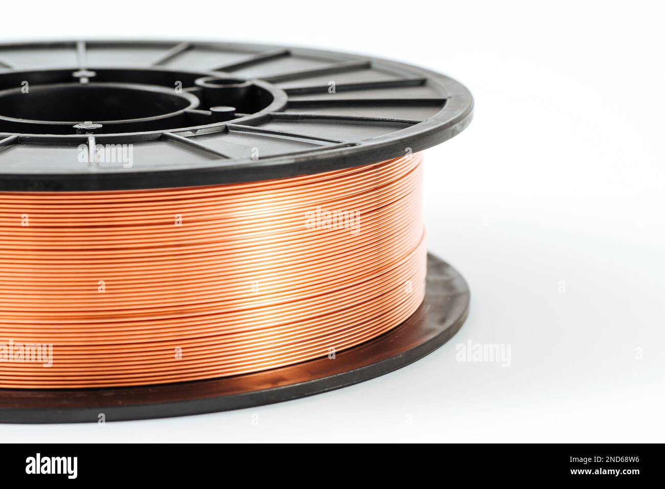 Welding wire spool on a white background Stock Photo - Alamy