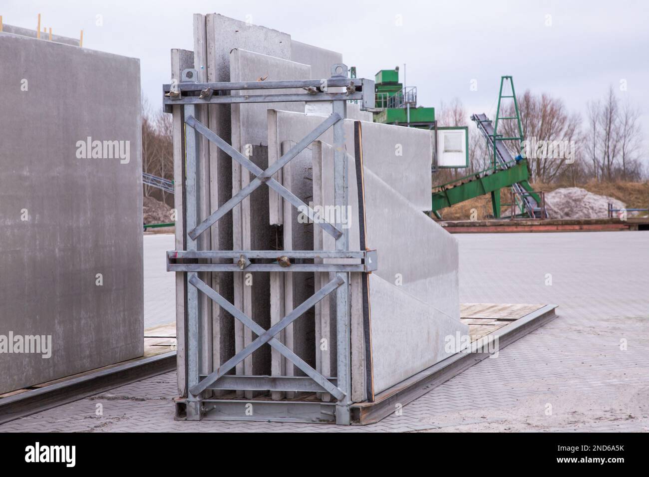 Picture of precast concrete walls ready for shipping in transport racks ...