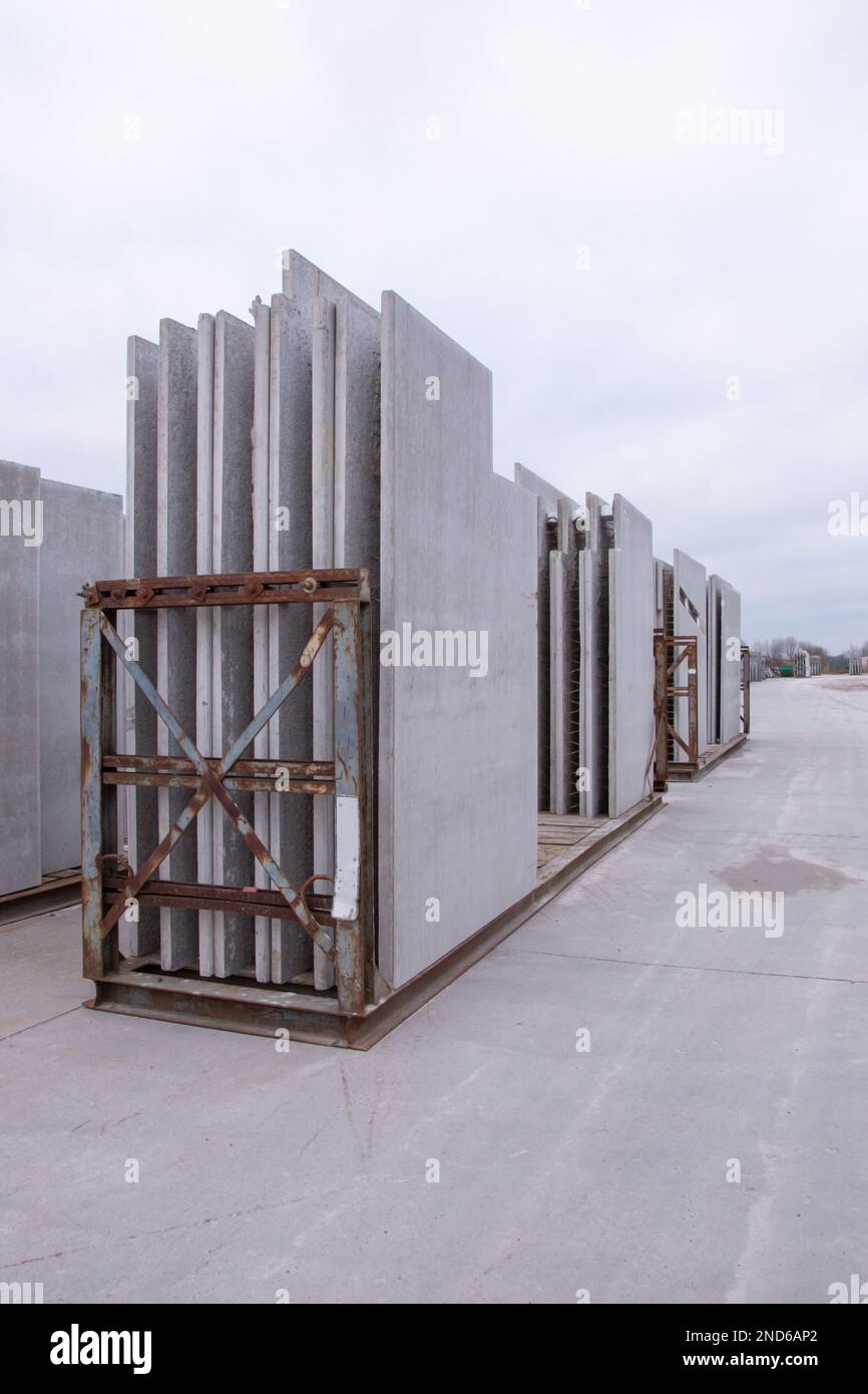 Picture of precast concrete walls ready for shipping in transport racks ...