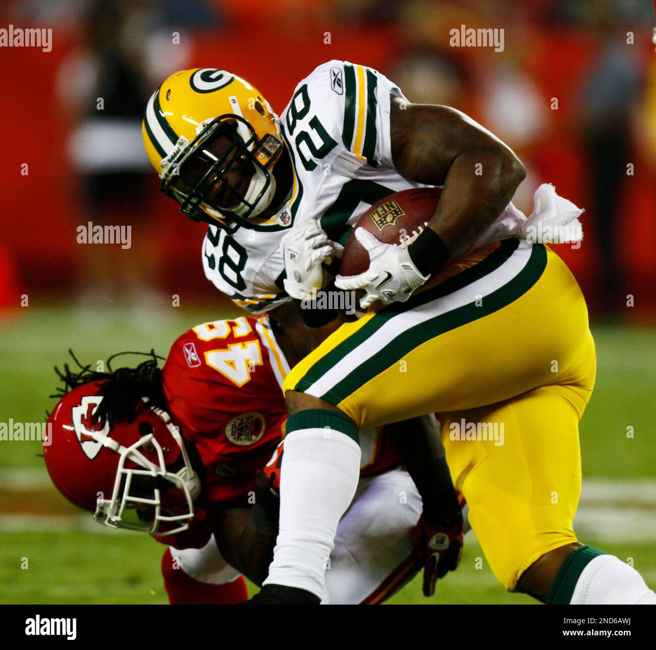 Green Bay Packers running back Kregg Lumpkin (28) is tackled by Kansas ...