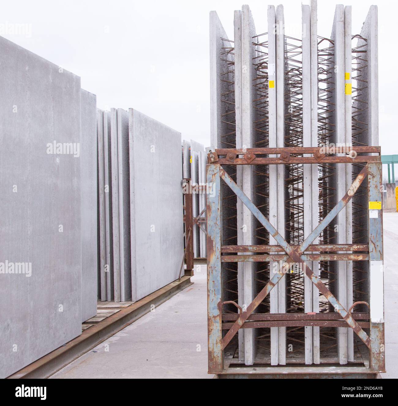 Picture of precast concrete walls ready for shipping in transport racks ...
