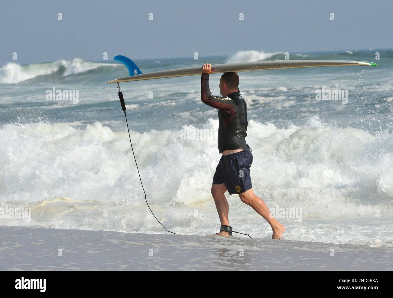 Lifeguard James Schnaufer takes advantage of the huge waves generated ...