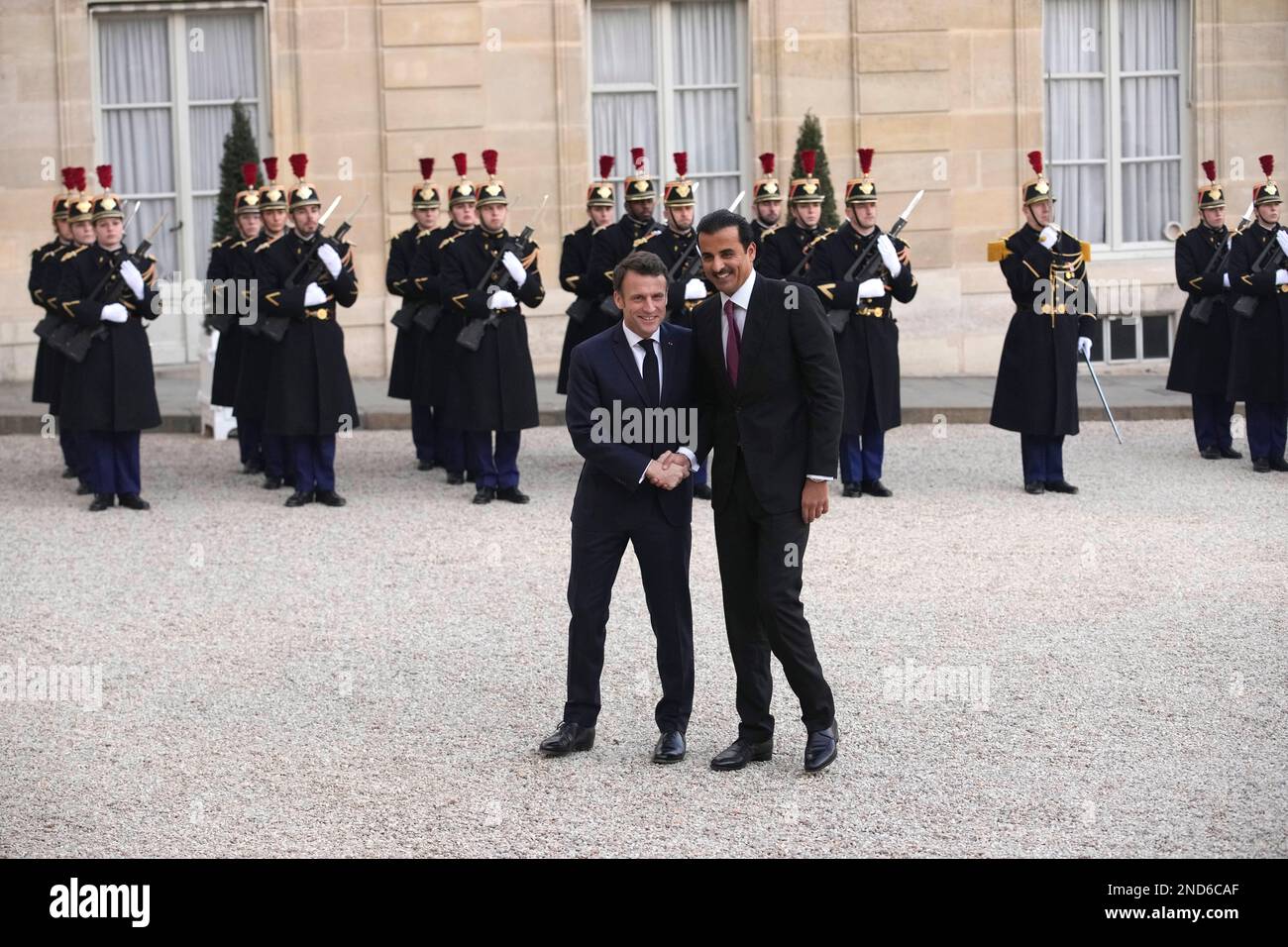 French President Emmanuel Macron, left, greets the Emir of Qatar Sheikh ...
