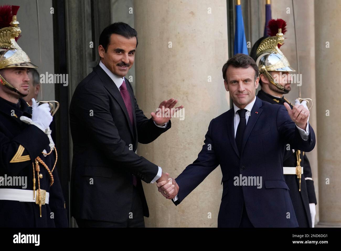 French President Emmanuel Macron, right, poses with the Emir of Qatar Sheikh Tamim bin Hamad Al ...