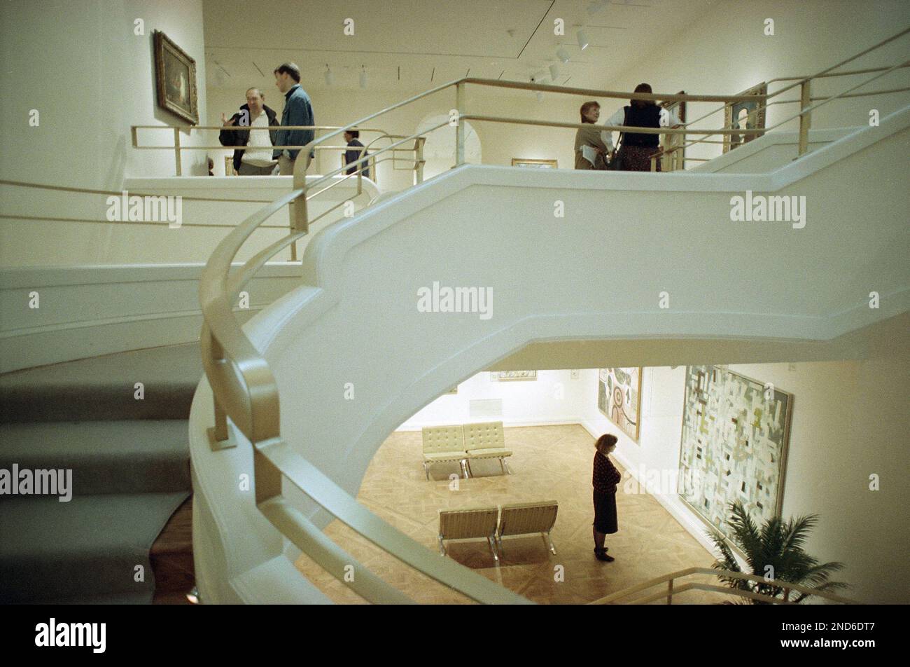 Art patrons peruse works in the two-level Goh Annex of the Phillips ...