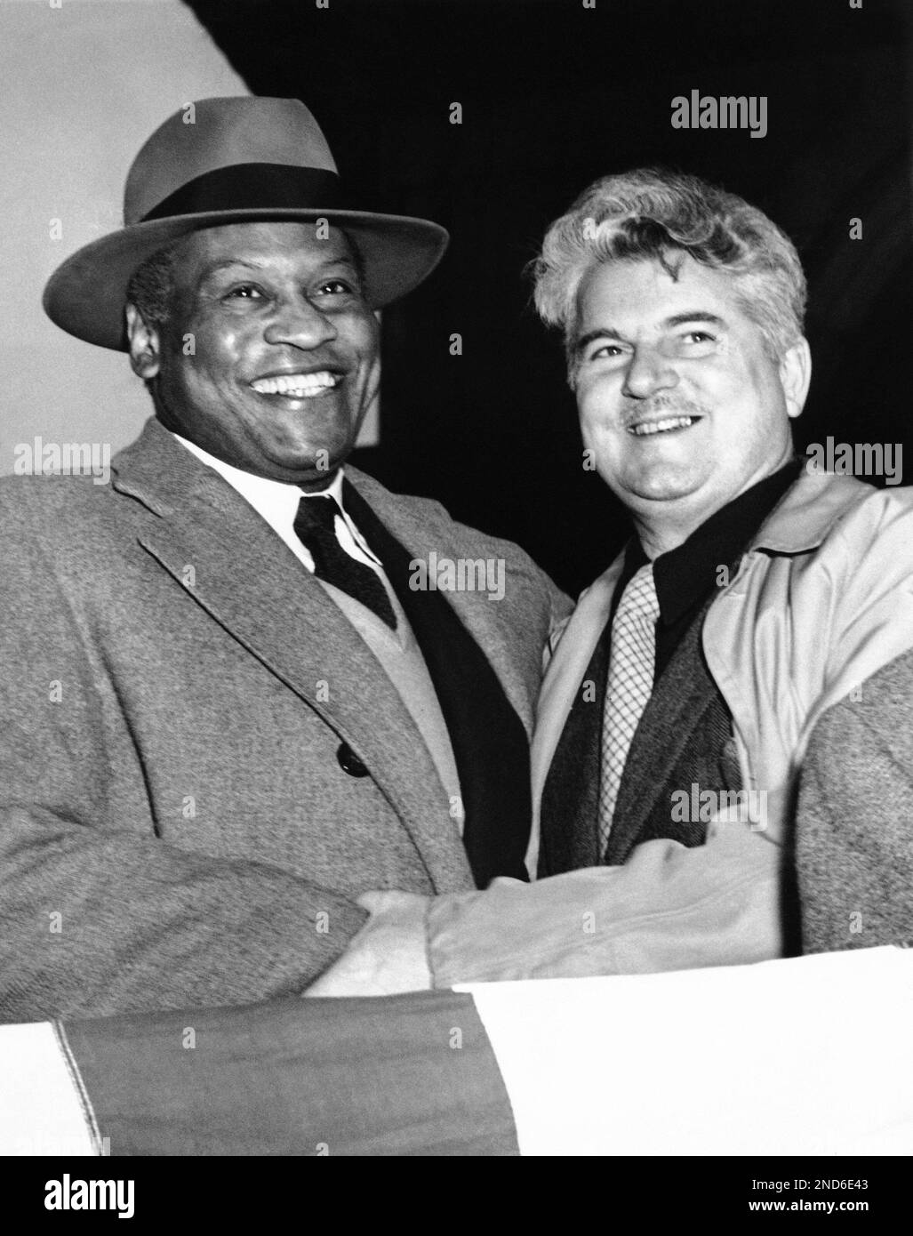 Eugene Dennis, right, secretary general of the Communist party, and ...