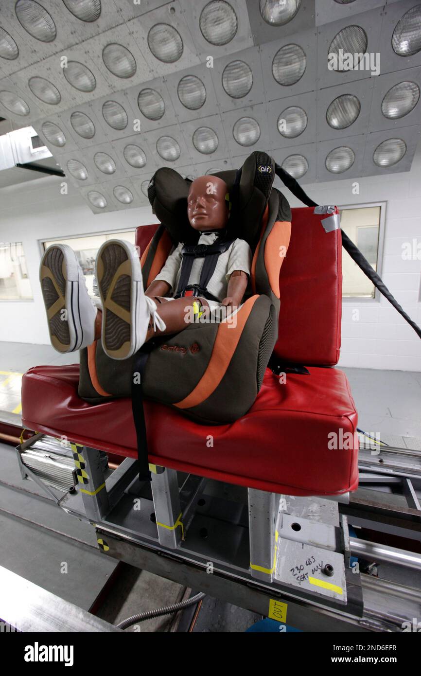 A child restraint system is readied for a side impact sled test at the ...