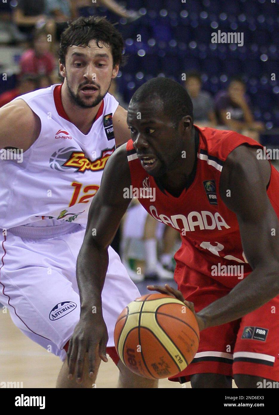 Canada’s Denham Brown, right, drives to the basket as he is guarded by ...