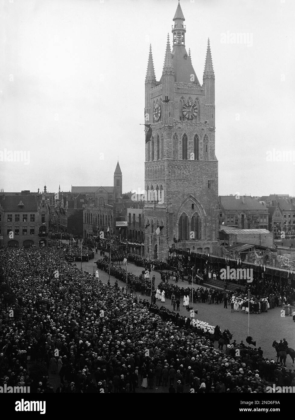 A huge crowd watches the inauguration of the reconstructed belfry, part ...