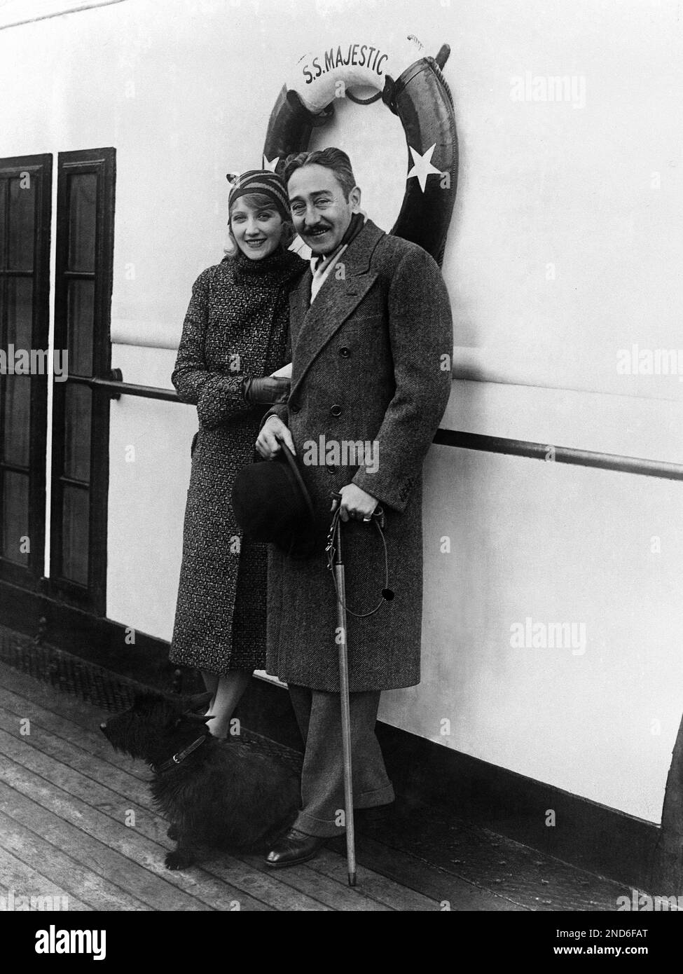 American actor Adolphe Menjou with wife actress Kathryn Carver on board ...