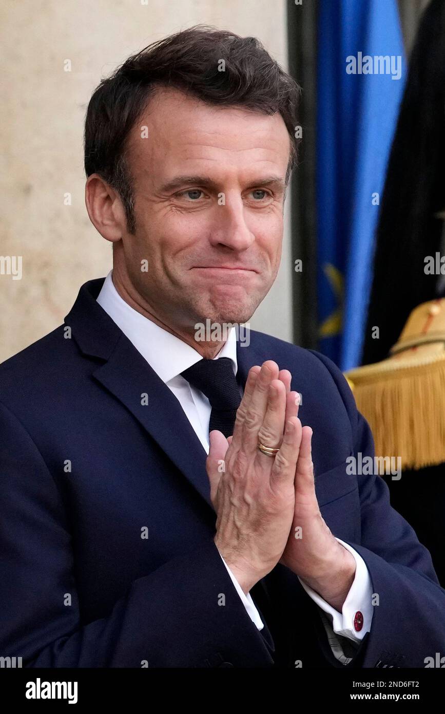 French President Emmanuel Macron, waves to journalists beffore greeting ...