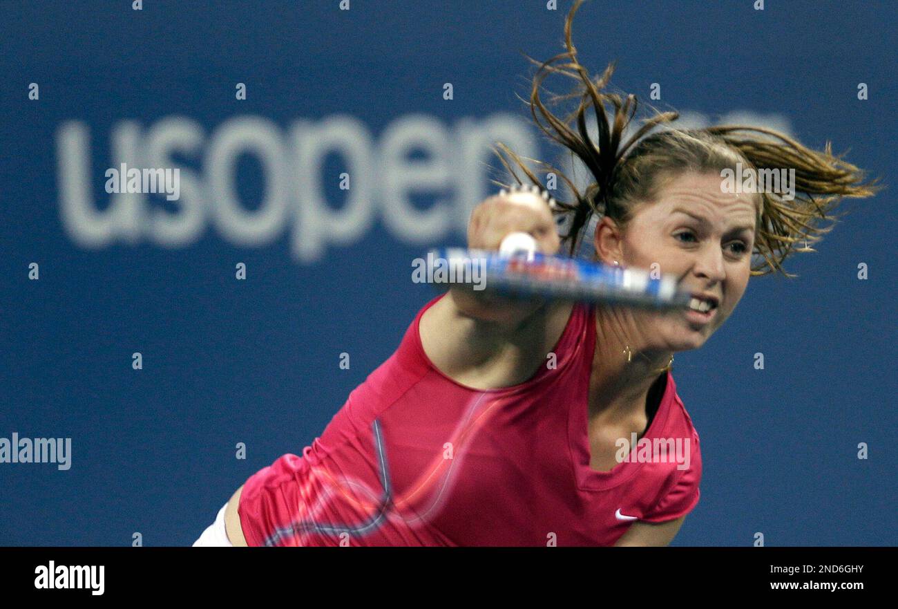 Sally Peers, of Australia, serves to Kim Clijsters, of Belgium, at the ...