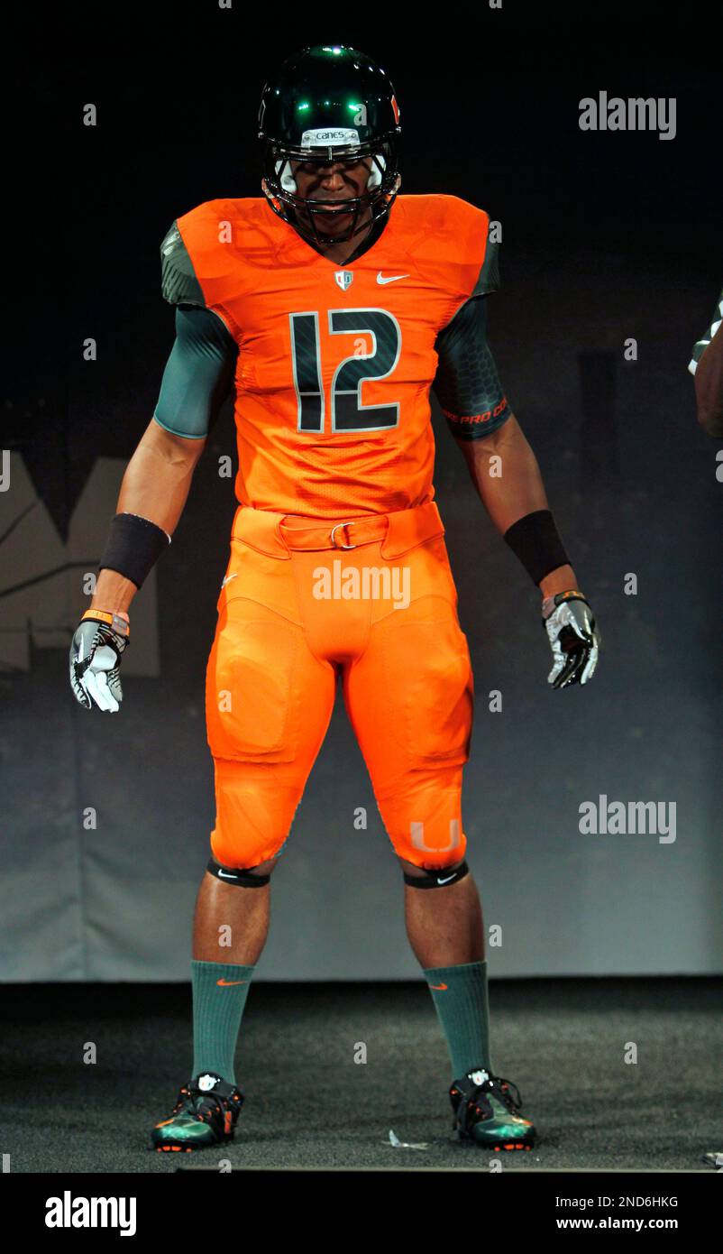 A model wears the new University of Miami Nike football uniform ...