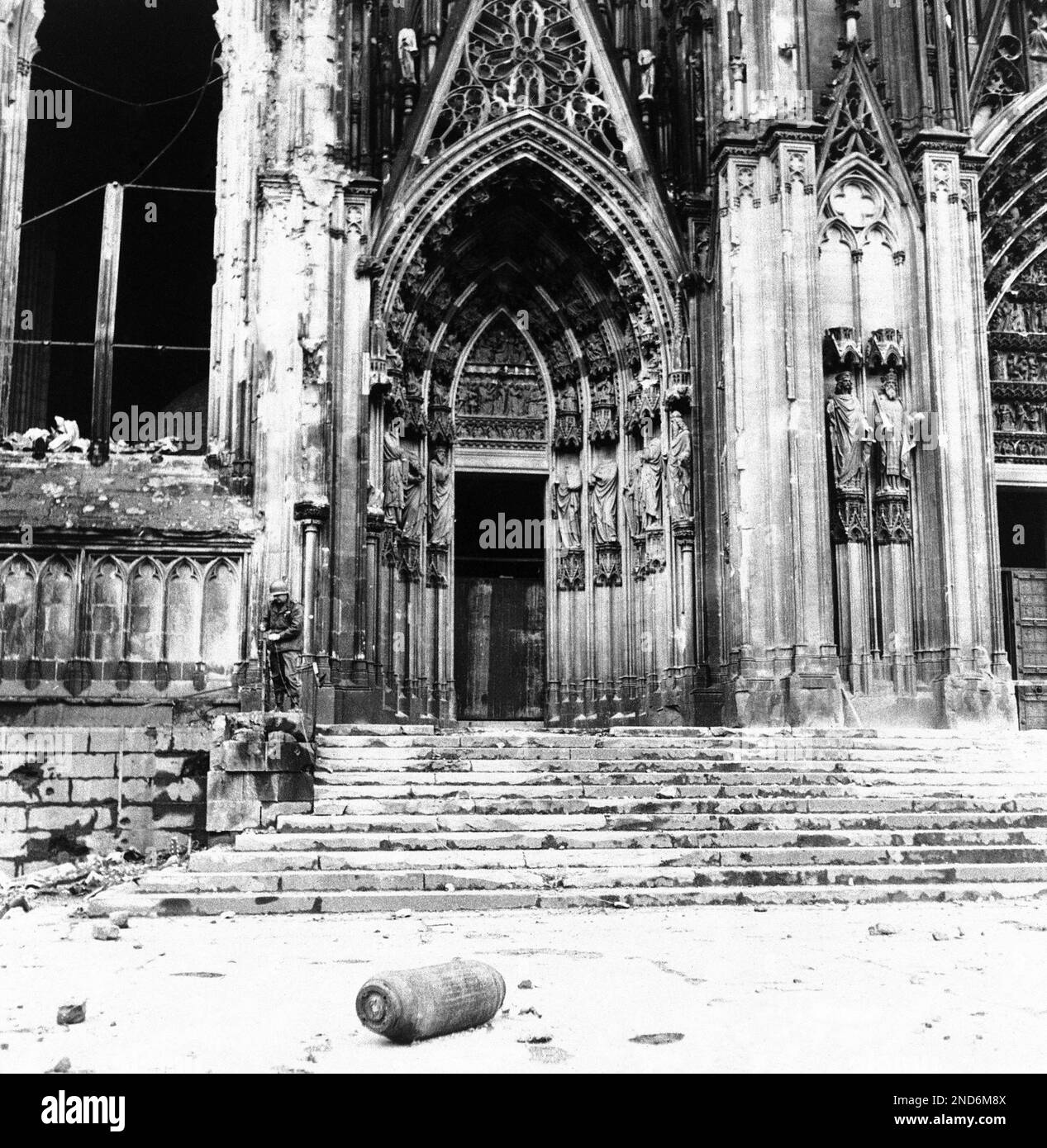 An unexploded bomb lies on the pavement in front of the famous ...