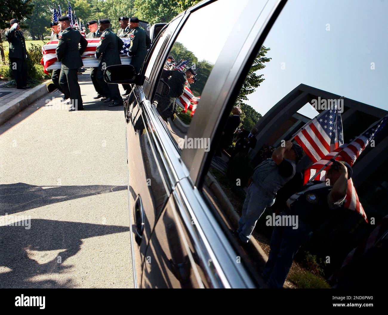 U.S. Army soldiers carry the American Flag-draped coffin Tuesday, Aug ...
