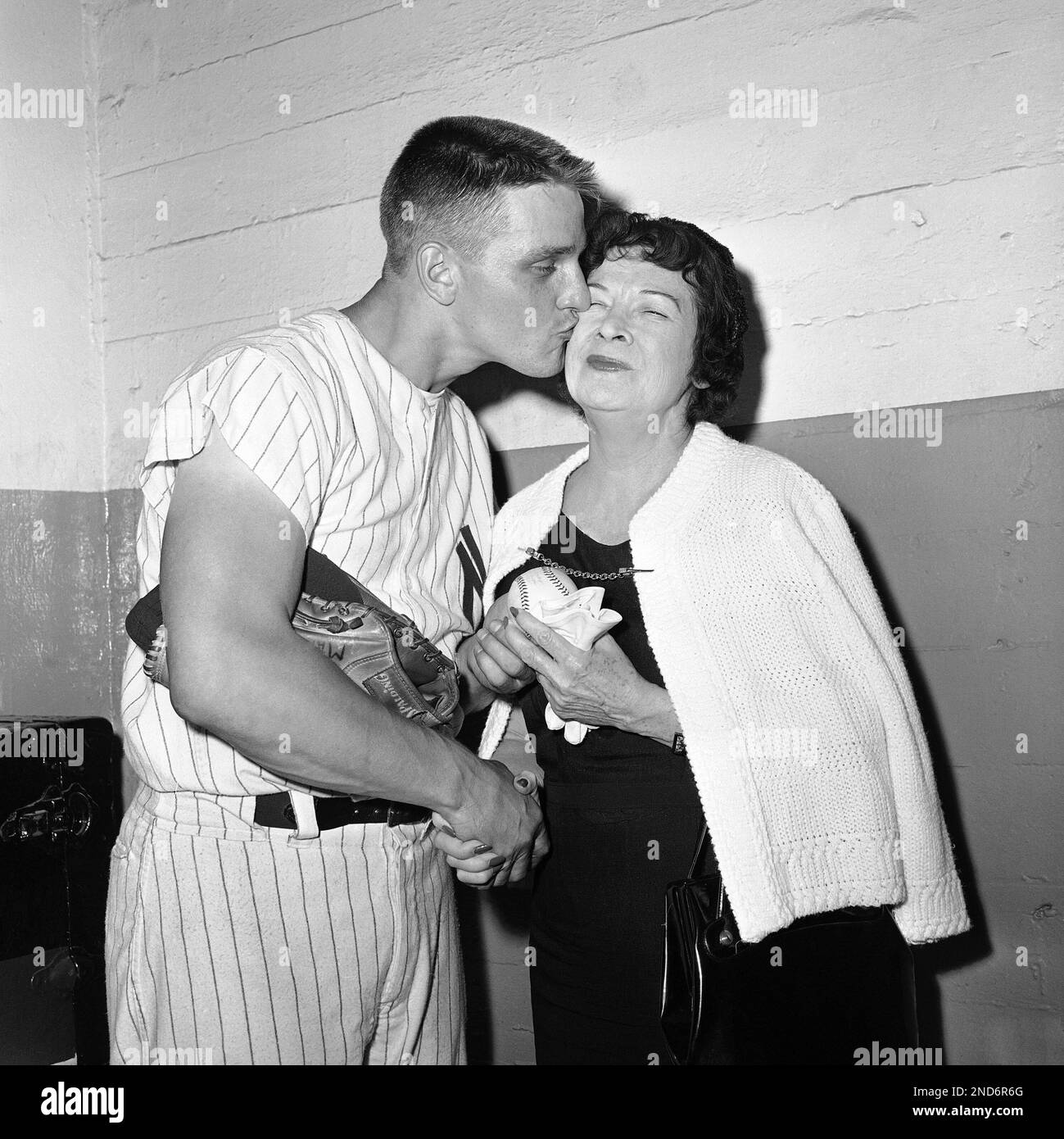 New York Yankee Roger Maris kisses Mrs. Clare Ruth on meeting after ...