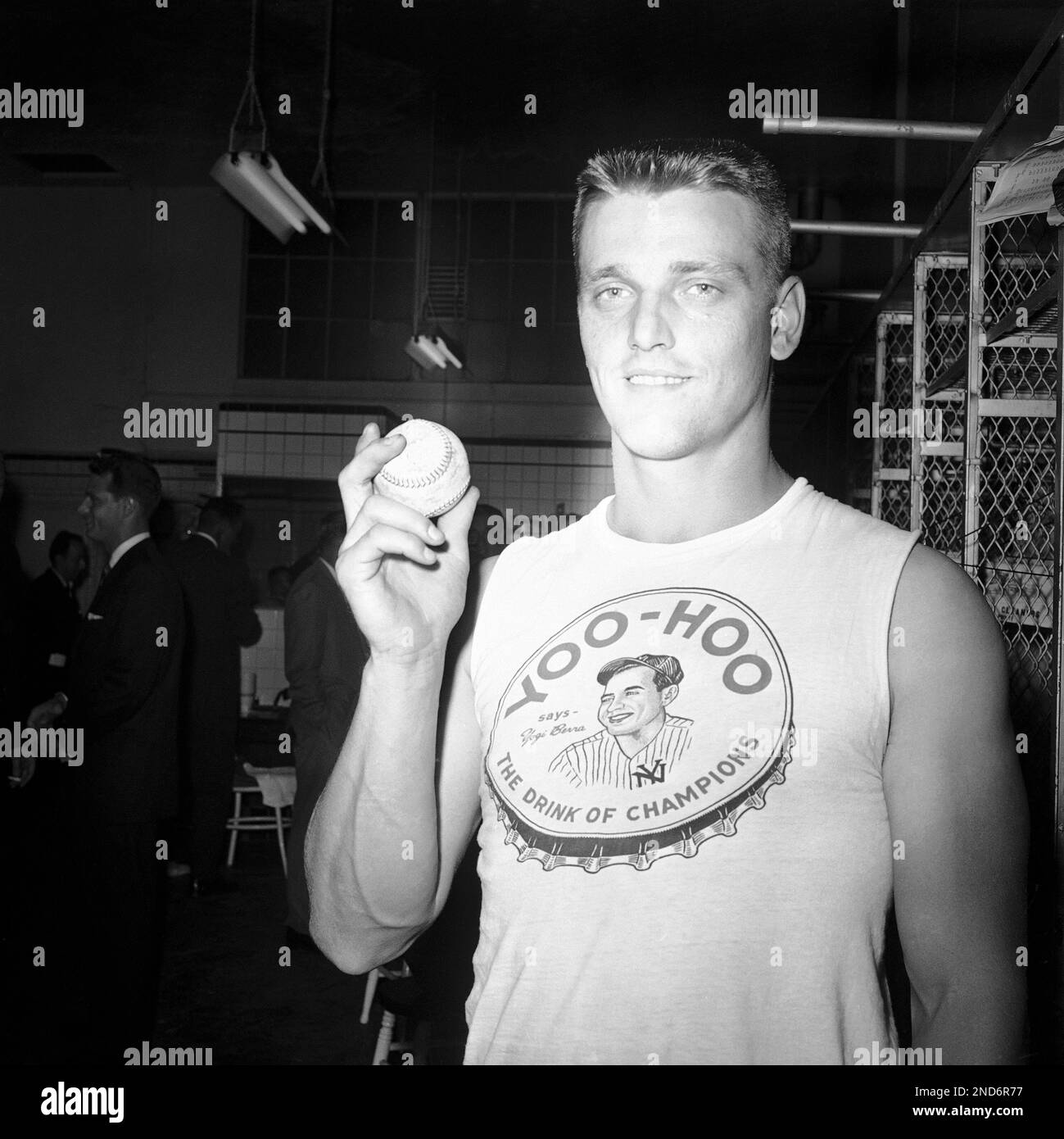 Roger Maris holds the ball he hit for a home run at Detroit Sept. 17 ...