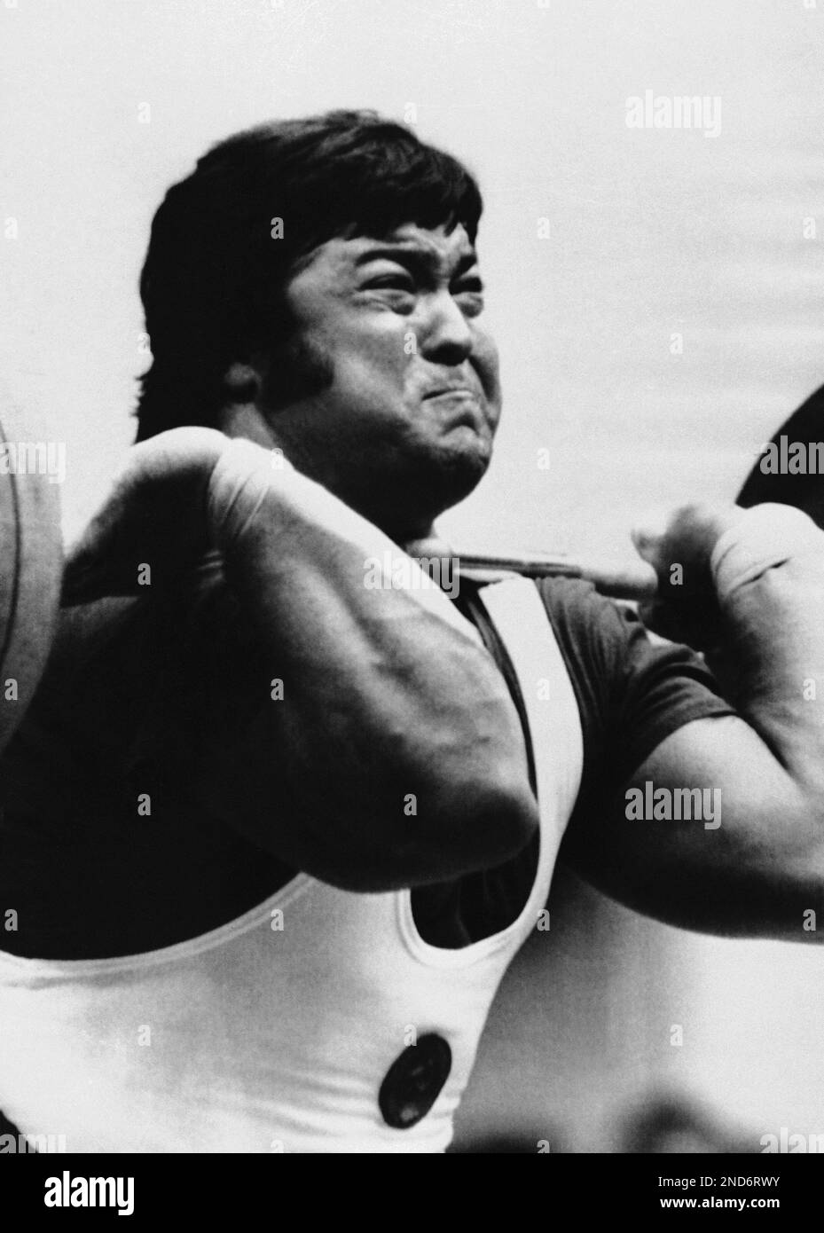 Soviet weightlifter Sultan Rakhmanov grimaces as he prepares to lift ...