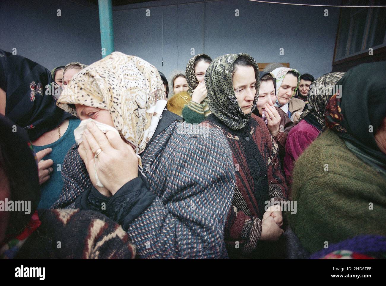 Chechen Muslim women weep at a funeral for a man killed during the ...