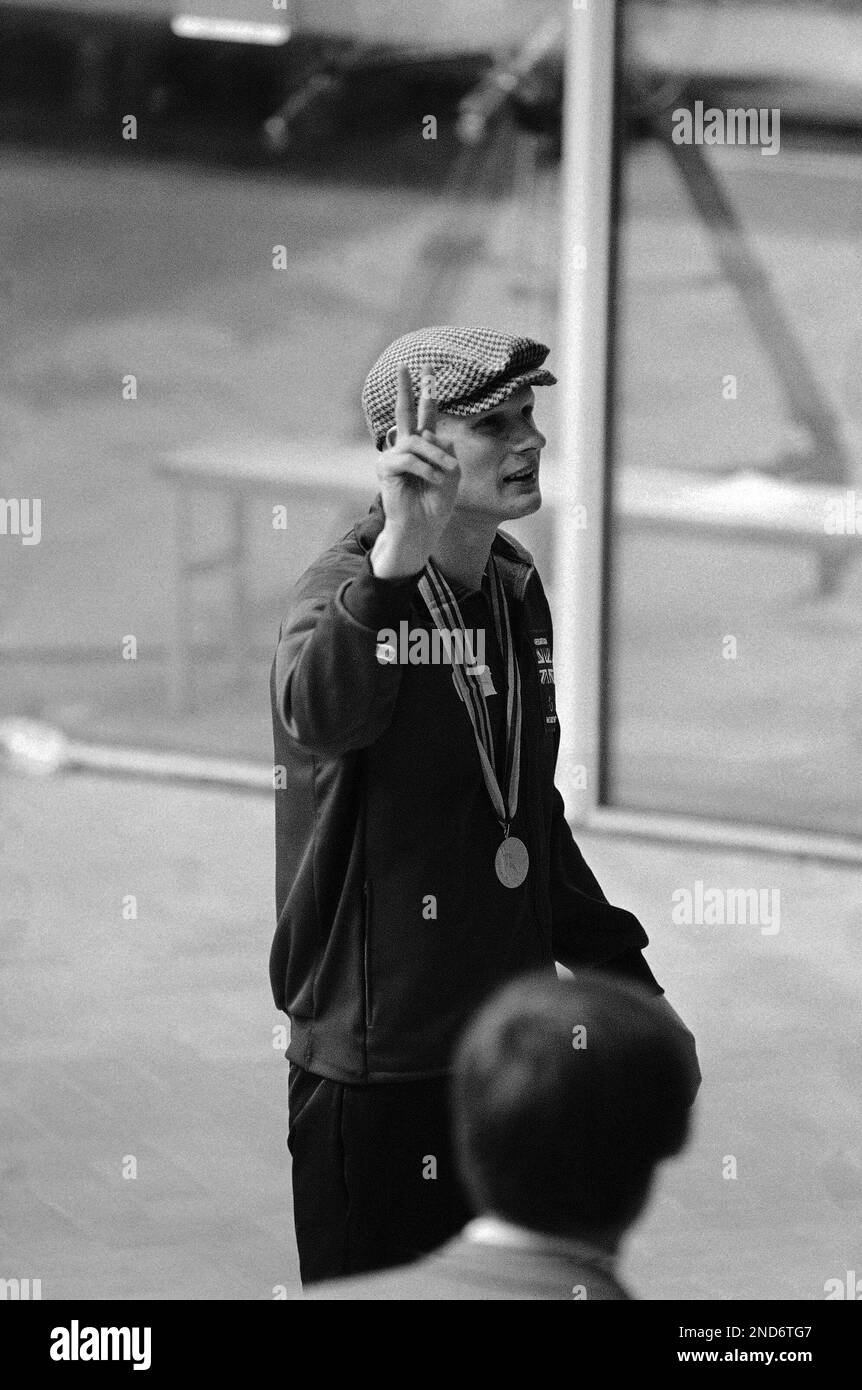 British swimmer Duncan Goodhew shows off his newly won gold medal in ...