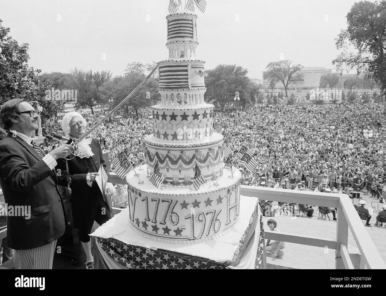 James Rhoads of the National Archives prepares to cut a Bicentennial ...