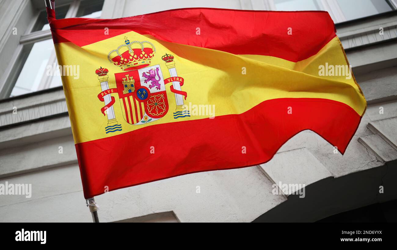 Spain flag waving on a building Stock Photo - Alamy