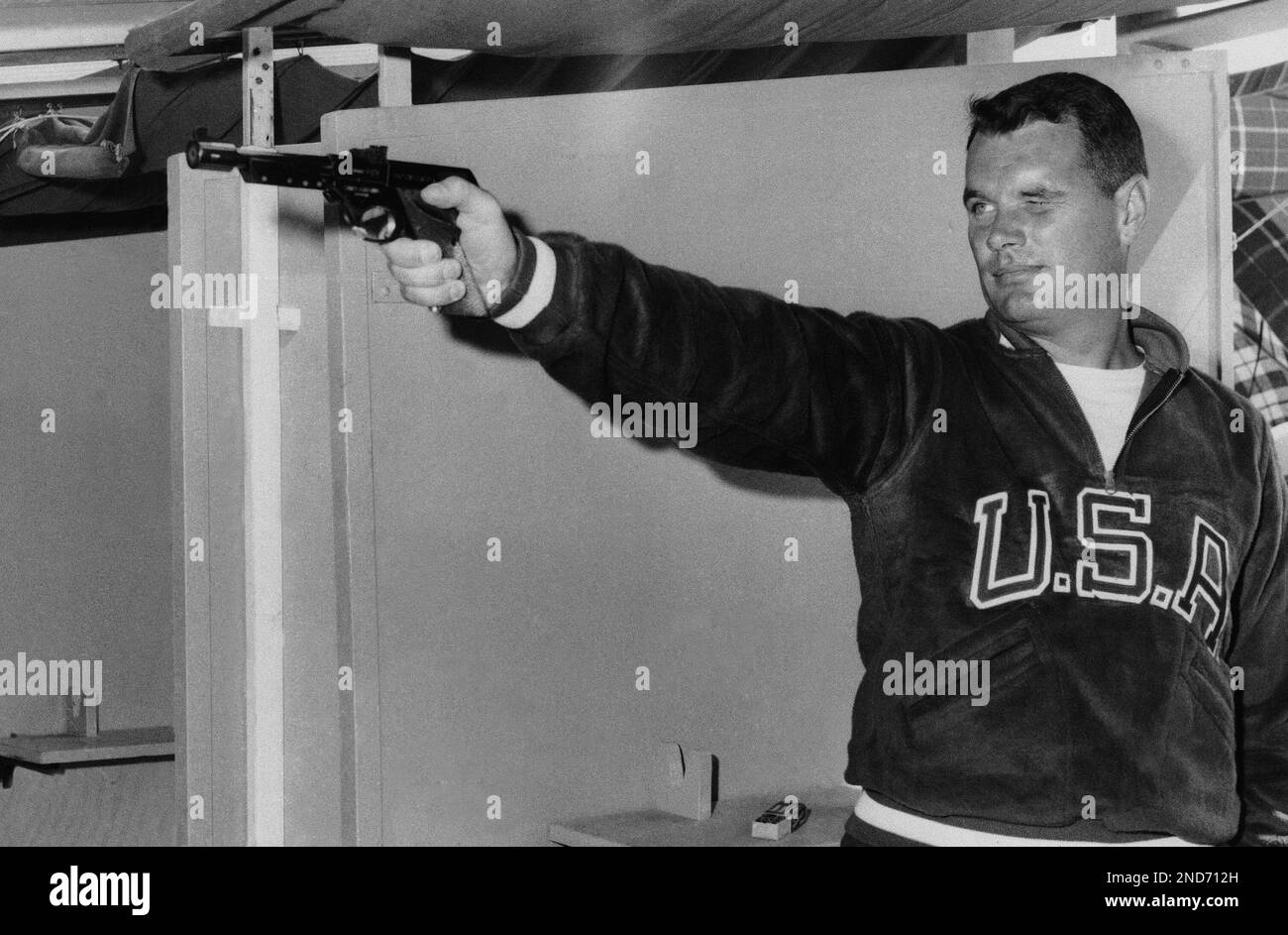 U.S. Marine Captain Bill McMillan, of Turtle Creek, Pa., fires in ...