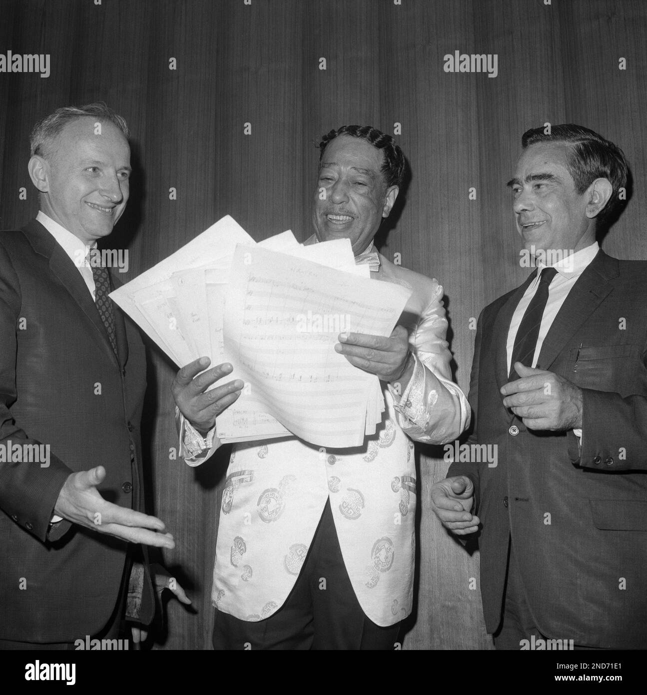 Duke Ellington, center, Jazz great, presents the original manuscript of ...