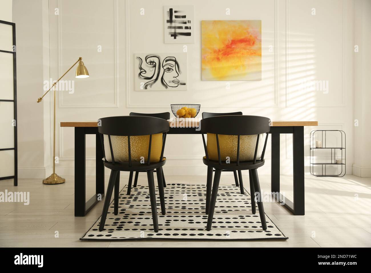 Stylish wooden dining table and chairs in room. Interior design Stock ...