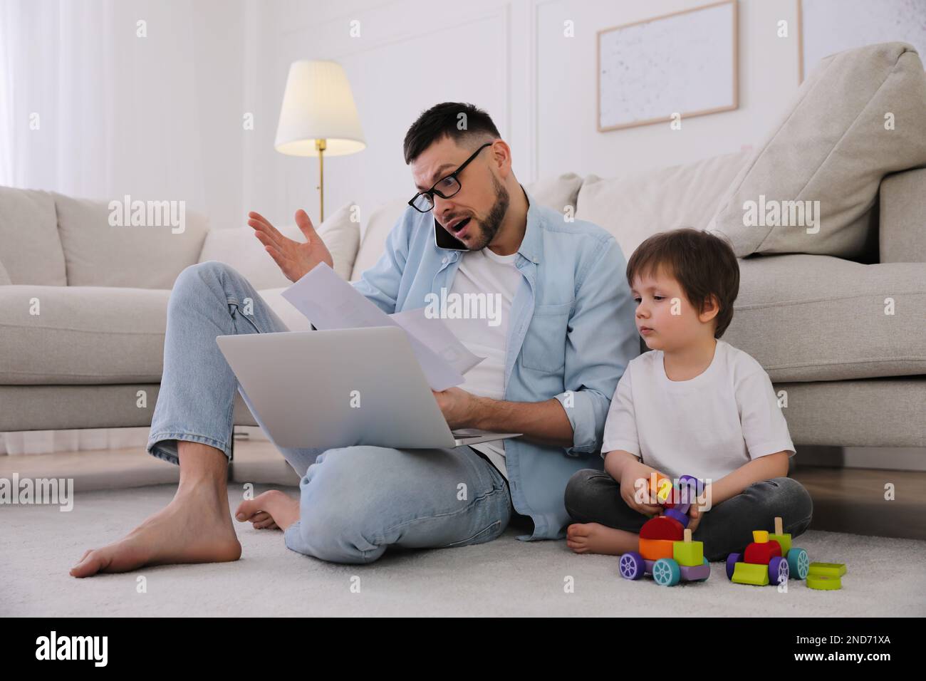 Man multitasking child hi-res stock photography and images - Alamy