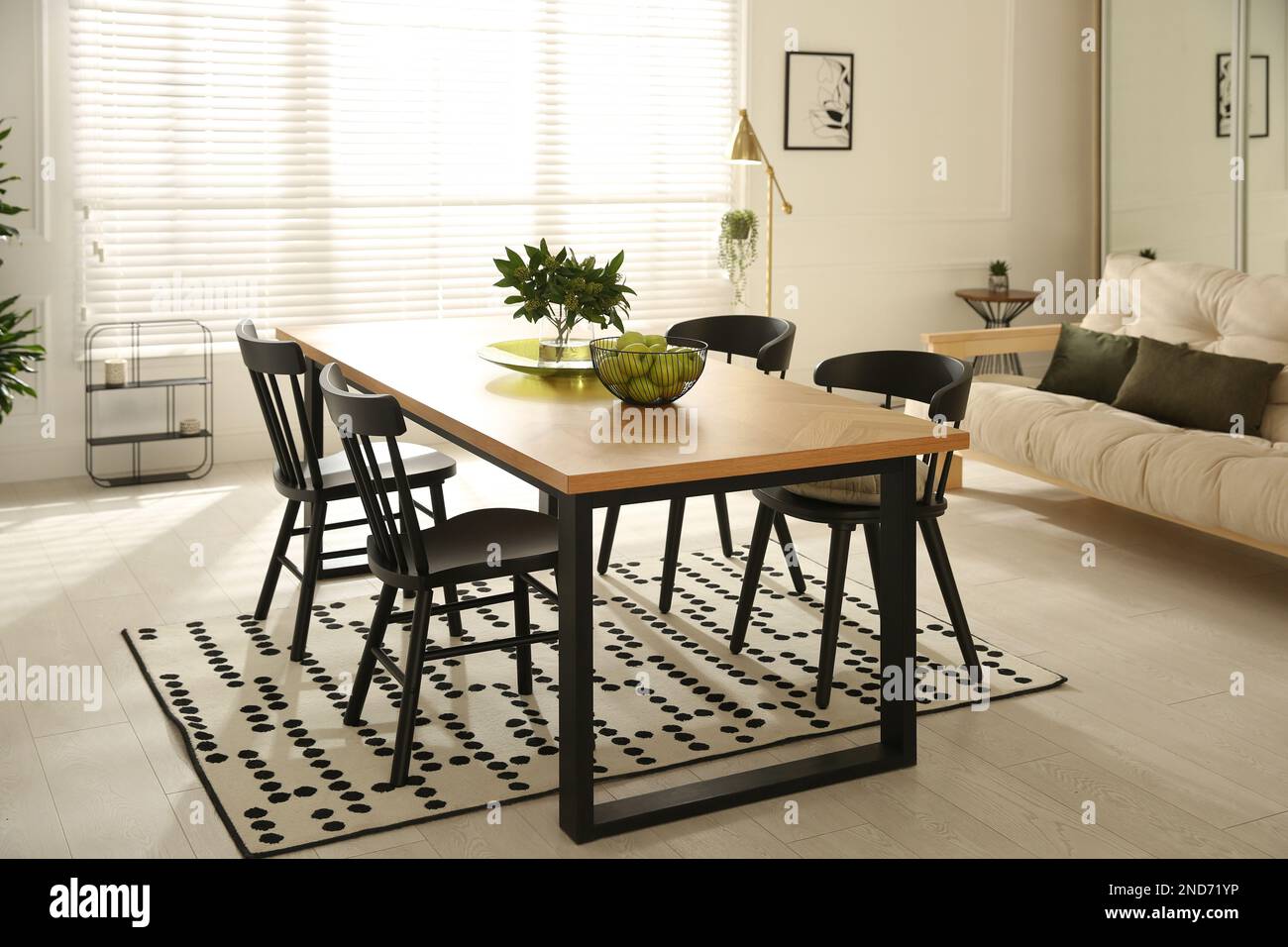 Stylish wooden dining table and chairs in room. Interior design Stock ...